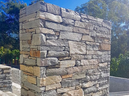 Sign With Stone Pillars